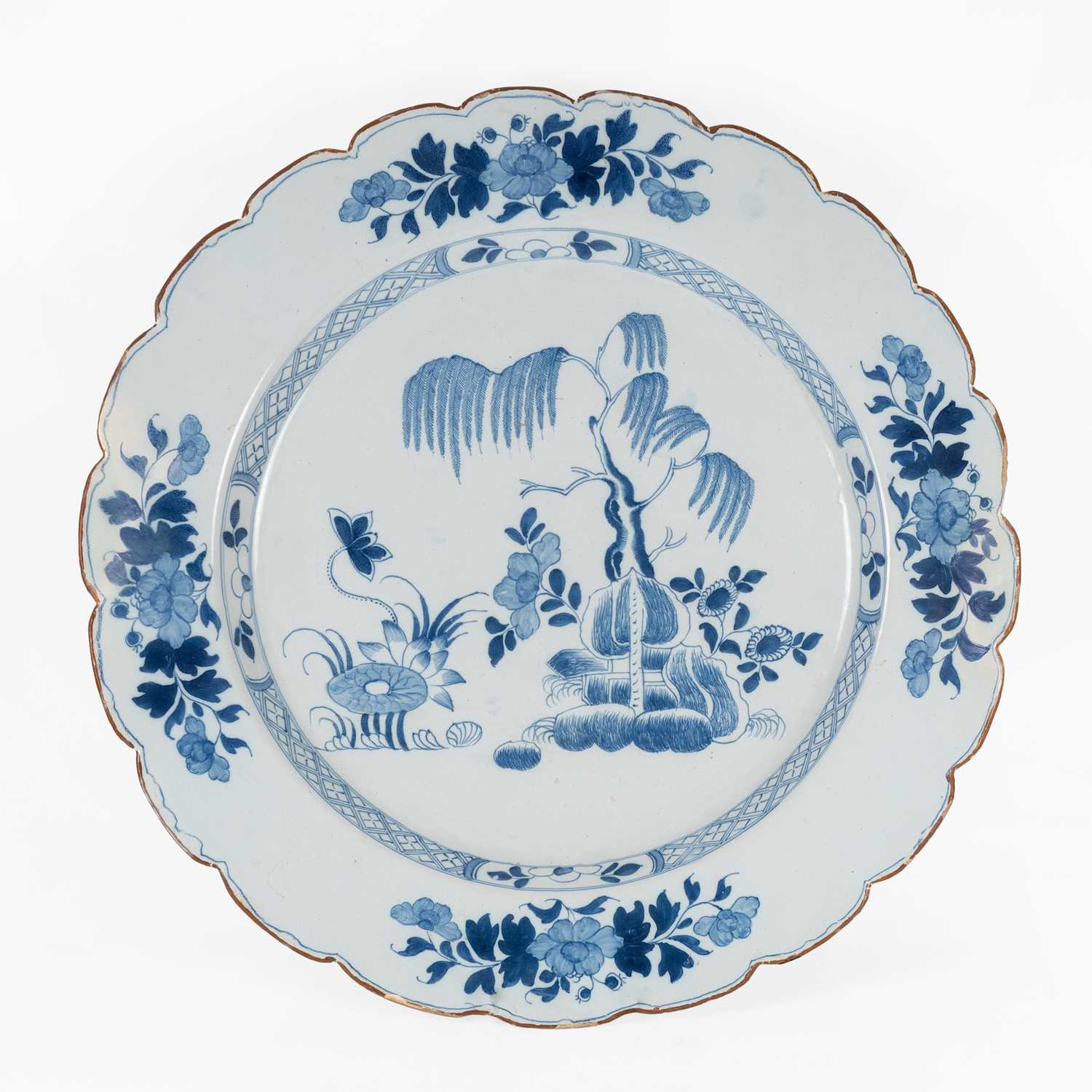 Lot 34 - A Large English Delft Charger, circa 1770,