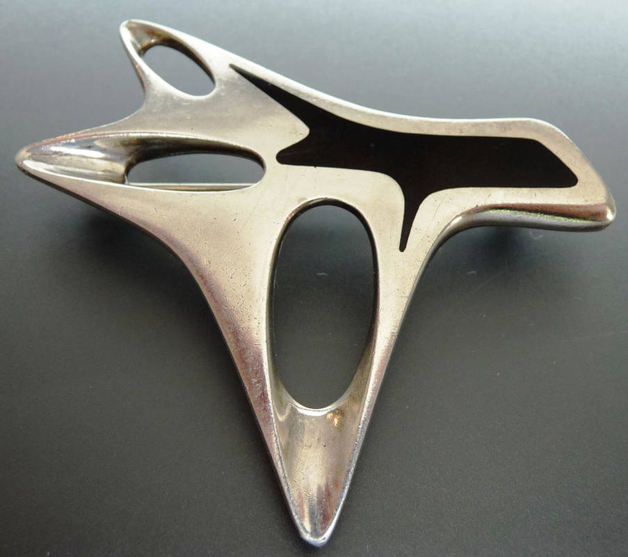 Lot 179 - An Enamelled Silver "323" Brooch, by Georg