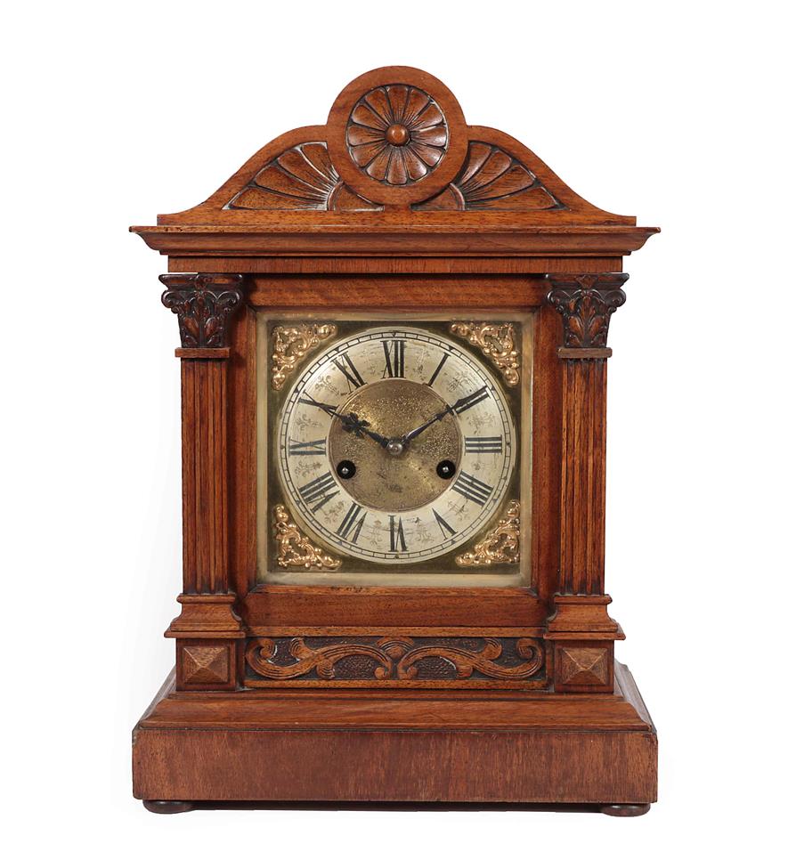 Lot 253 - A Walnut Quarter Striking Mantel Clock,